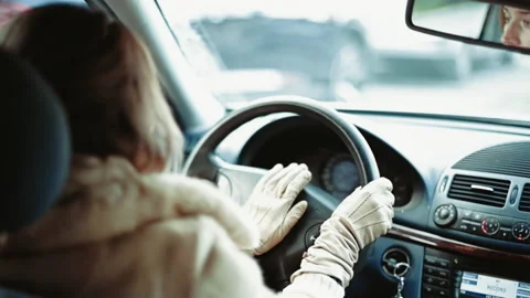 Woman driving a car in slow motion, hand... | Stock Video | Pond5