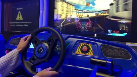 Woman driving a racing game. Girl on a r... | Stock Video | Pond5