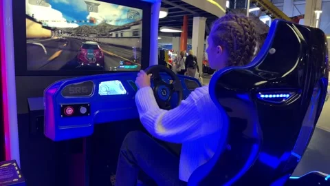 Woman driving a racing game. Girl on a r... | Stock Video | Pond5