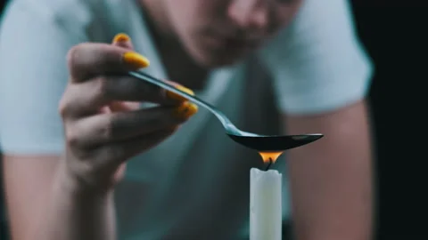 Woman Drug Addict Cooking Drugs in Spoon... | Stock Video | Pond5