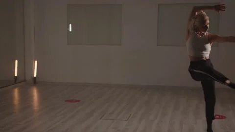 Woman elegantly dancing alone in a dance... | Stock Video | Pond5