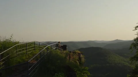 Woman at end of metal railing guiding tr... | Stock Video | Pond5