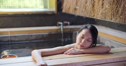 Woman enjoy onsen bath in bathtub | Stock Video | Pond5