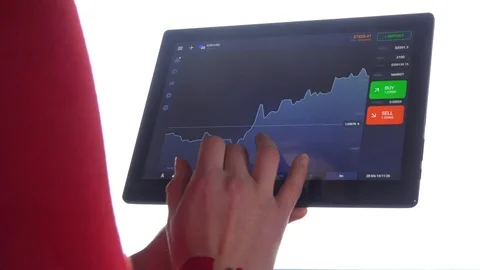 A woman examines a chart on a tablet - c... | Stock Video | Pond5