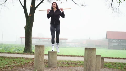 Woman exercise step up in outdoor gym 4K | Stock Video | Pond5