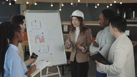 Woman explaining architectural project o... | Stock Video | Pond5