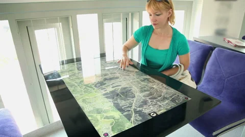 Woman exploring map on touch screen tabl... | Stock Video | Pond5
