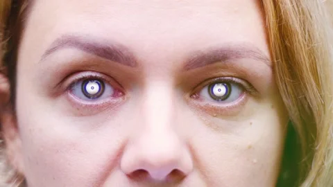 Woman face with changing color eye pupil... | Stock Video | Pond5