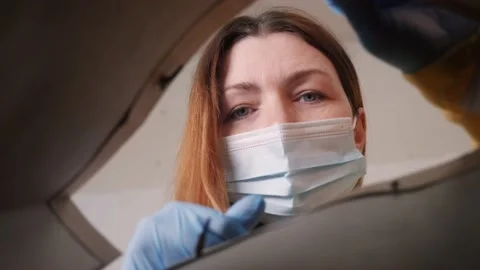 woman face in mask opens a packet bag of... | Stock Video | Pond5