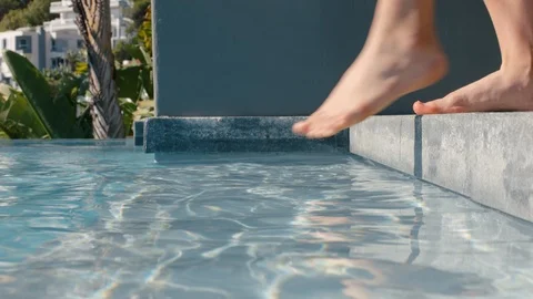 woman feet touching water with toes in s... | Stock Video | Pond5