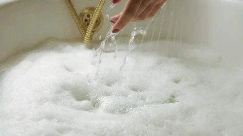 Woman filling the bathtub with water, wo... | Stock Video | Pond5