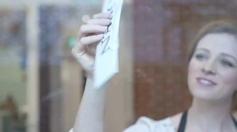 Woman flipping over closed sign | Stock Video | Pond5