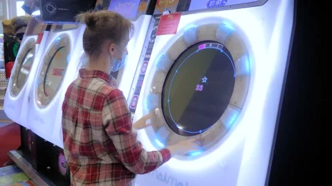 Woman gamer playing in Japanese arcade r... | Stock Video | Pond5
