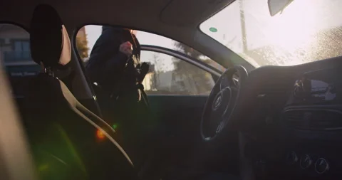 Woman getting into car for going to home | Stock Video | Pond5