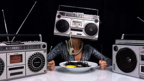 Woman with ghettoblaster as a head eatin... | Stock Video | Pond5