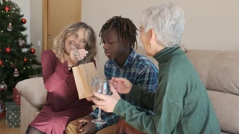 Woman giving a gift to her partner while... | Stock Video | Pond5