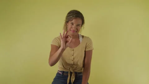 Woman Giving the "A-OK" Signal in Front ... | Stock Video | Pond5