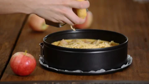 Woman grating pastry dough with a grater... | Stock Video | Pond5