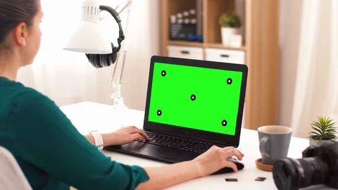 woman with green screen on laptop at hom... | Stock Video | Pond5