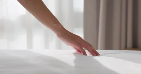 woman hand on bed | Stock Video | Pond5