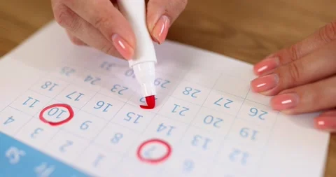Woman hand marks the dates on calendar w... | Stock Video | Pond5