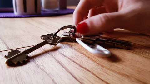 Woman Hand Picking up Keys from Table. C... | Stock Video | Pond5