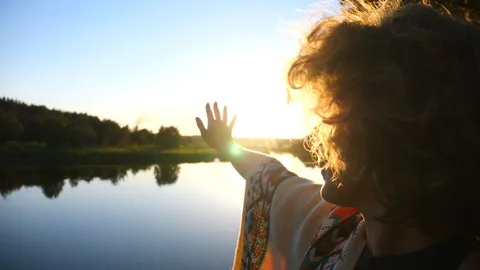 Woman Hand Reaching Out The Sun At Sunse... | Stock Video | Pond5