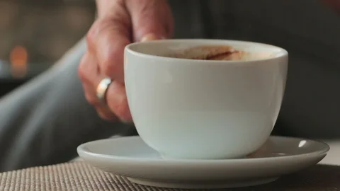 Woman hand take a cup of hot coffee latt... | Stock Video | Pond5