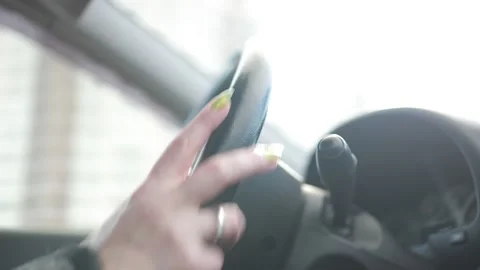 woman hands drive a car, fingers lie on ... | Stock Video | Pond5
