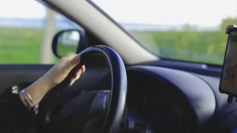 woman hands drive a car, fingers lie on ... | Stock Video | Pond5