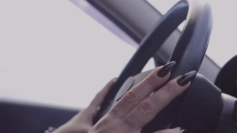 woman hands drive a car, fingers lie on ... | Stock Video | Pond5