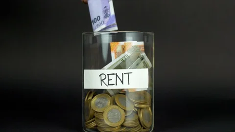 Woman hands dropping banknotes in a cont... | Stock Video | Pond5