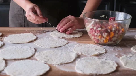 Woman hands making dumplings with meat,... | Stock Video | Pond5