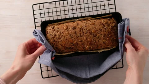 Woman hands take out hot bread from the ... | Stock Video | Pond5
