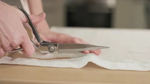 A woman holding big scissors in her hand... | Stock Video | Pond5