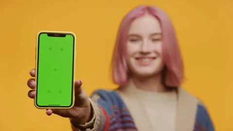 Woman Holding Green Screen Smartphone on... | Stock Video | Pond5