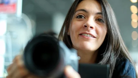 Woman holding video camera and filming p... | Stock Video | Pond5