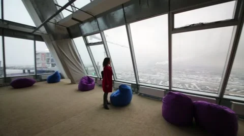 Woman in indoor observation deck with gl... | Stock Video | Pond5