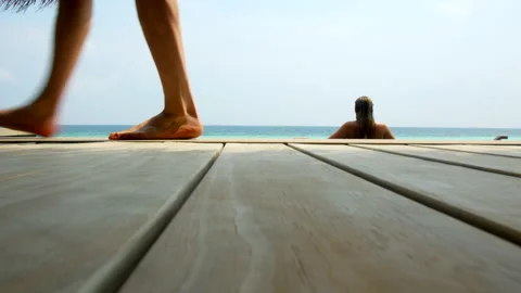 Woman in infinity pool, low angle feet w... | Stock Video | Pond5