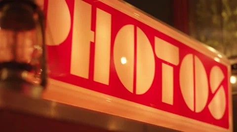 A woman joins her date in a photo booth | Stock Video | Pond5