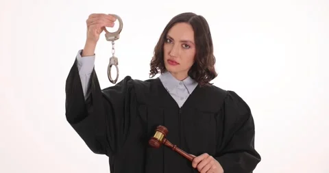 Woman judge holds handcuffs and gavel on... | Stock Video | Pond5
