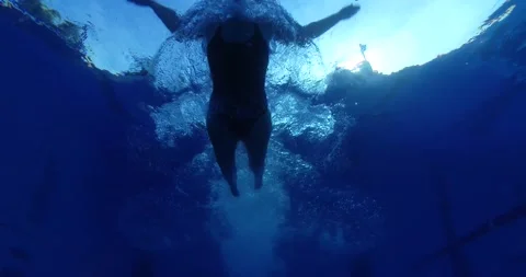 Woman Jump Into The Water And Swims Tn T... | Stock Video | Pond5
