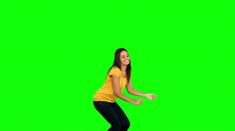 Woman jumping on green screen | Stock Video | Pond5