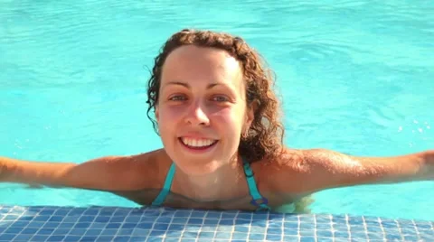Woman laying in wavy pool water and movi... | Stock Video | Pond5