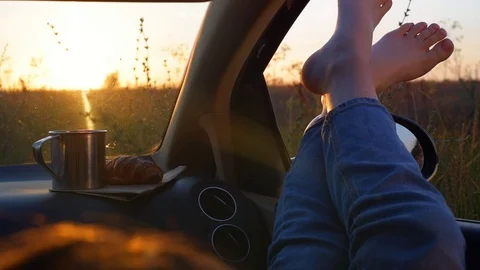 Woman legs out the windows in car . | Stock Video | Pond5
