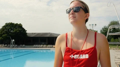 Woman Lifeguard Walking by a Public Swim... | Stock Video | Pond5