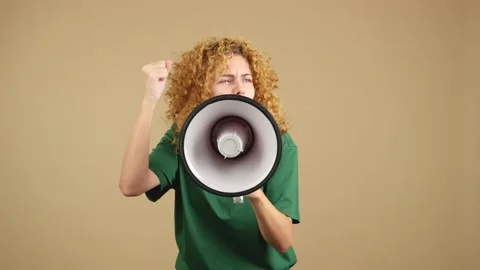 Woman looking at camera and shouting usi... | Stock Video | Pond5