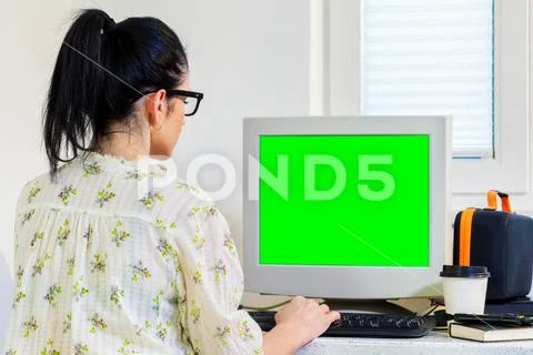 Woman looking on green screen computer ~ Premium Photo #120089699