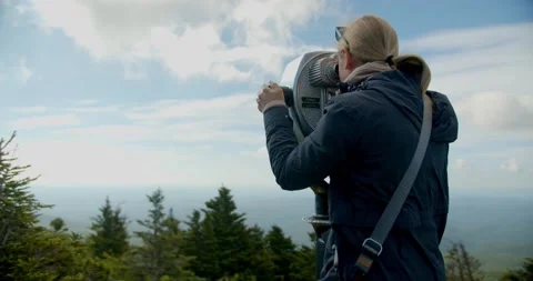 Woman Looking Through Viewfinder at Peak... | Stock Video | Pond5