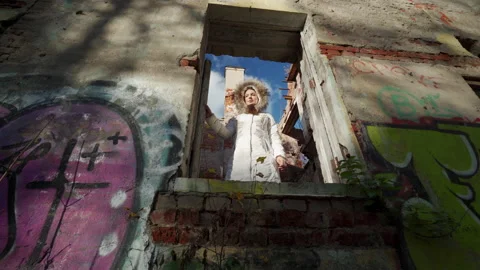 Woman looking through window frame of ol... | Stock Video | Pond5